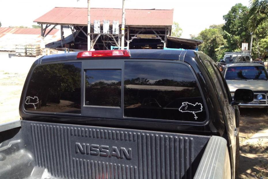 Signs of Catholicism commonly advertised on El Salvador's streets ...